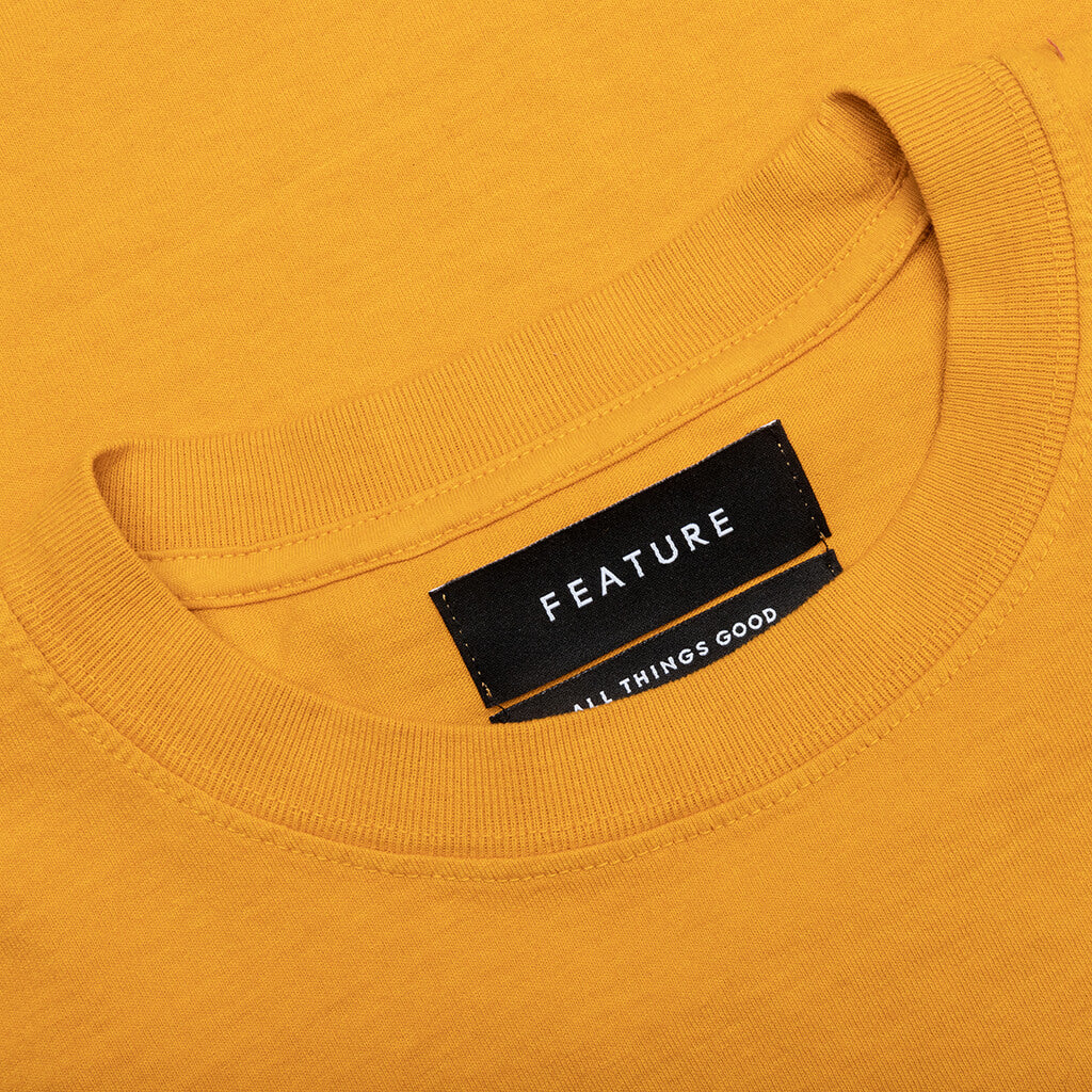 Wynn Logo Lock Up Tee - Golden Yellow – Feature