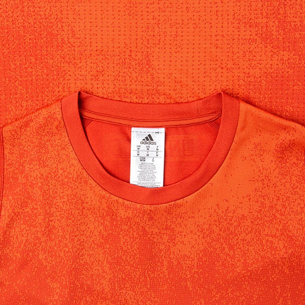 Originals x UNDEFEATED Knit Tee - Orange – Feature